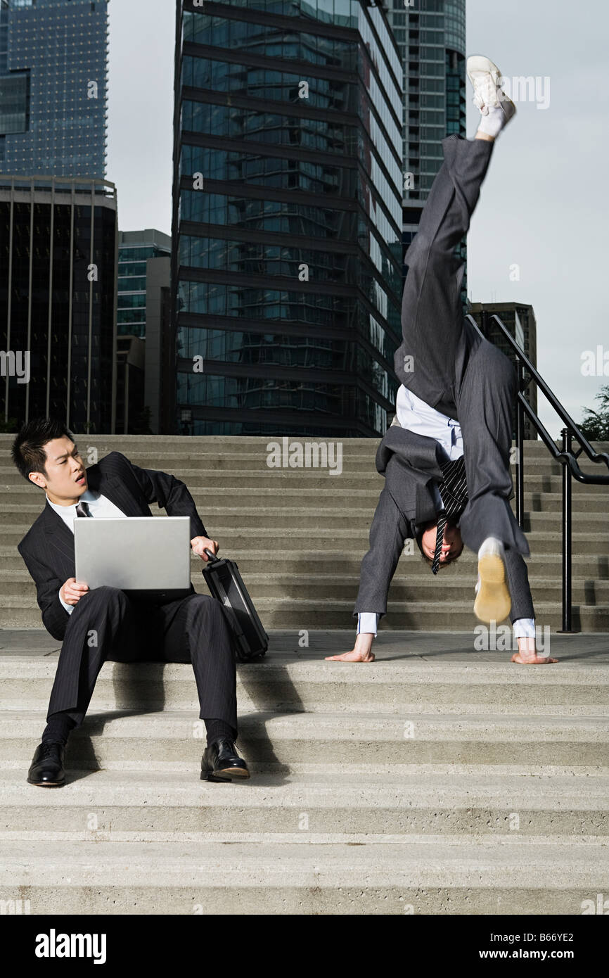 Office worker handstand hi-res stock photography and images - Alamy