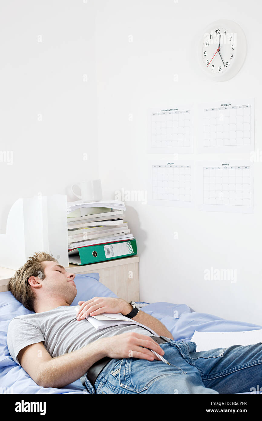 College student sleeping book bed hi-res stock photography and images ...