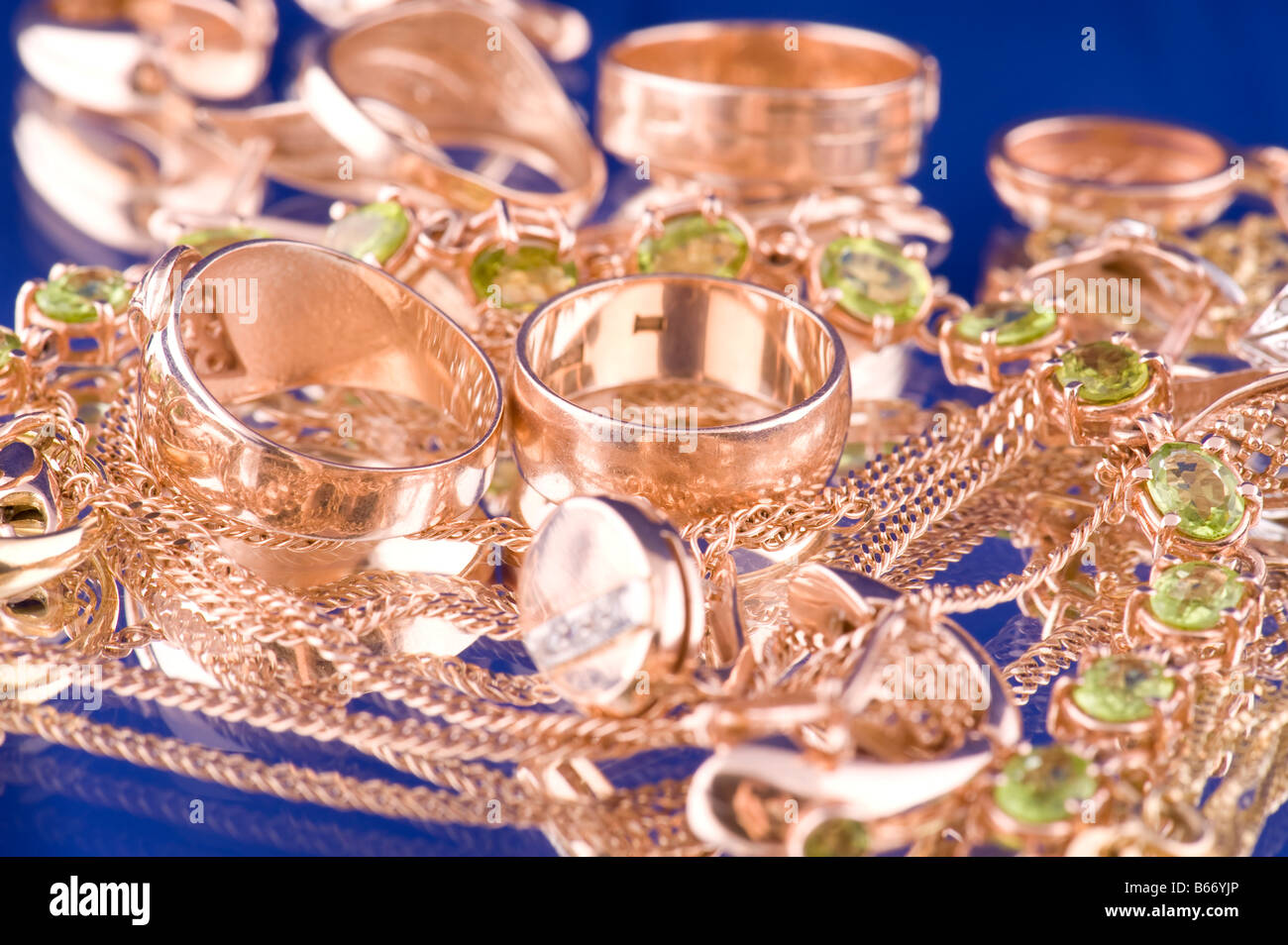 object on blue Gold valuable on blue Stock Photo - Alamy