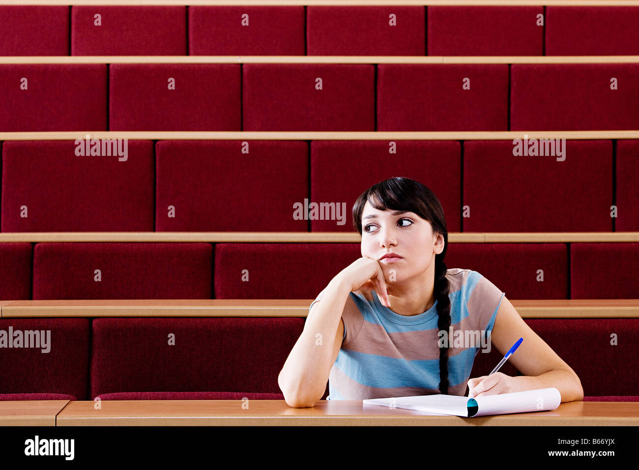 Female student in lecture Stock Photo - Alamy