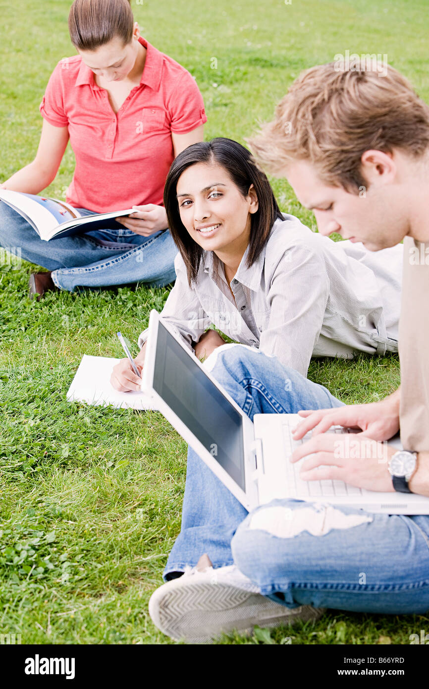 Three students studying on grass hi-res stock photography and images ...