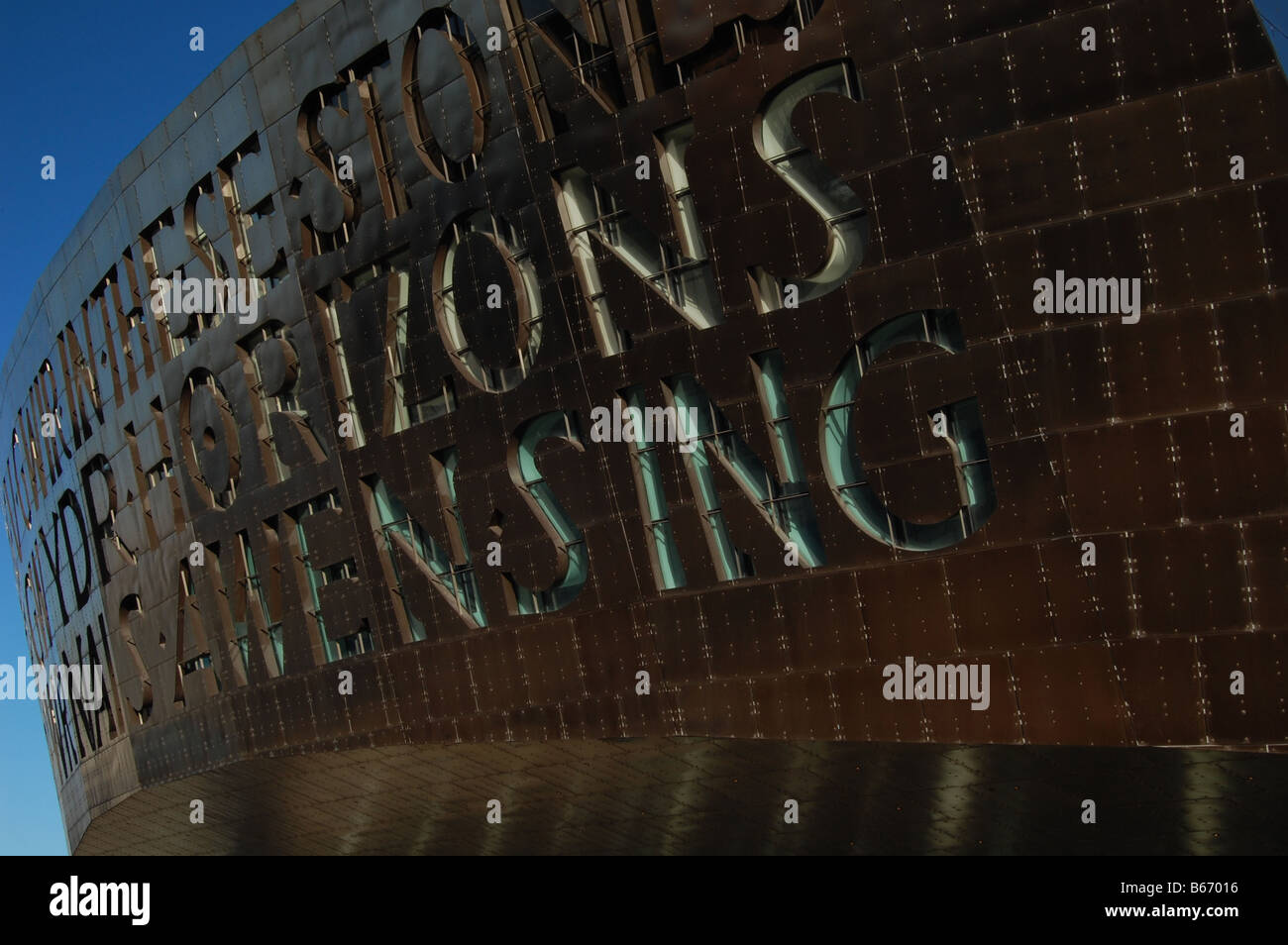 Side perspective view of the facade writing on the Wales Millennium ...