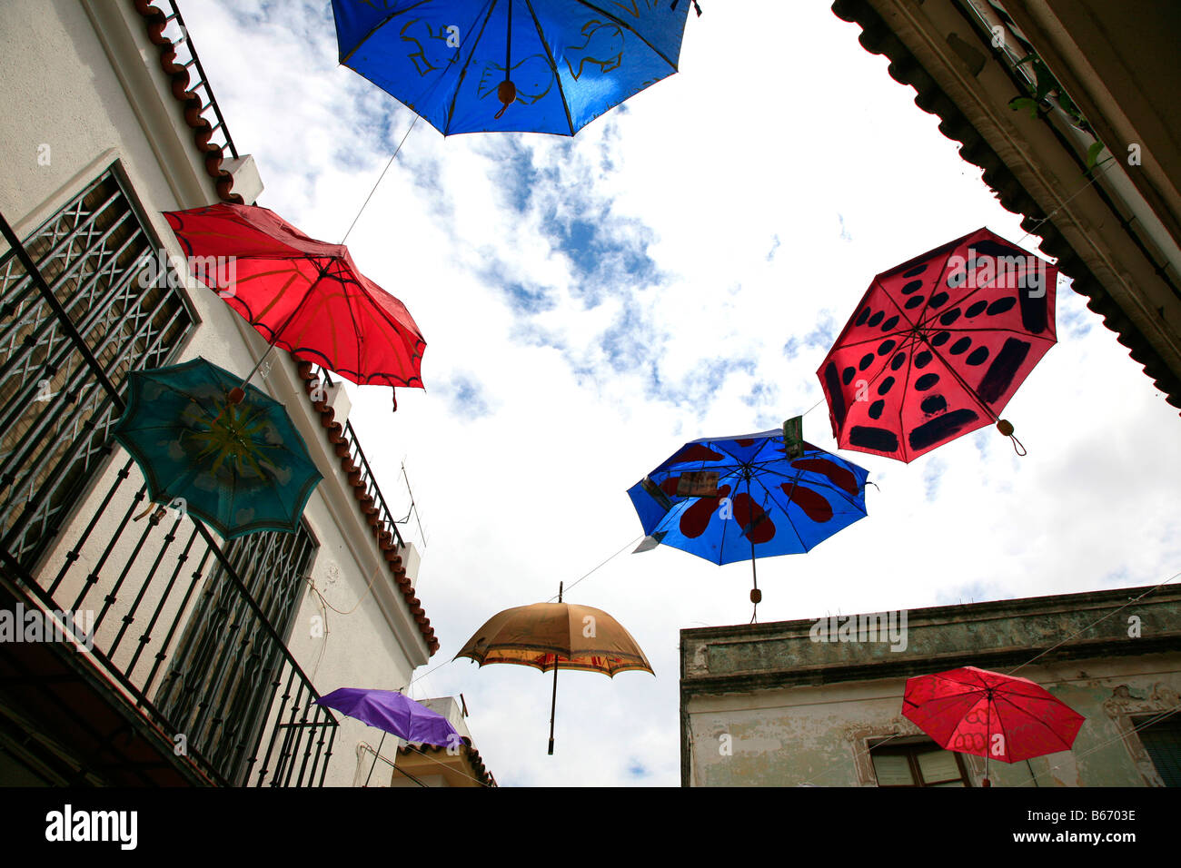 Art installation of umbrellas by local residents in a street in Cordoba ...