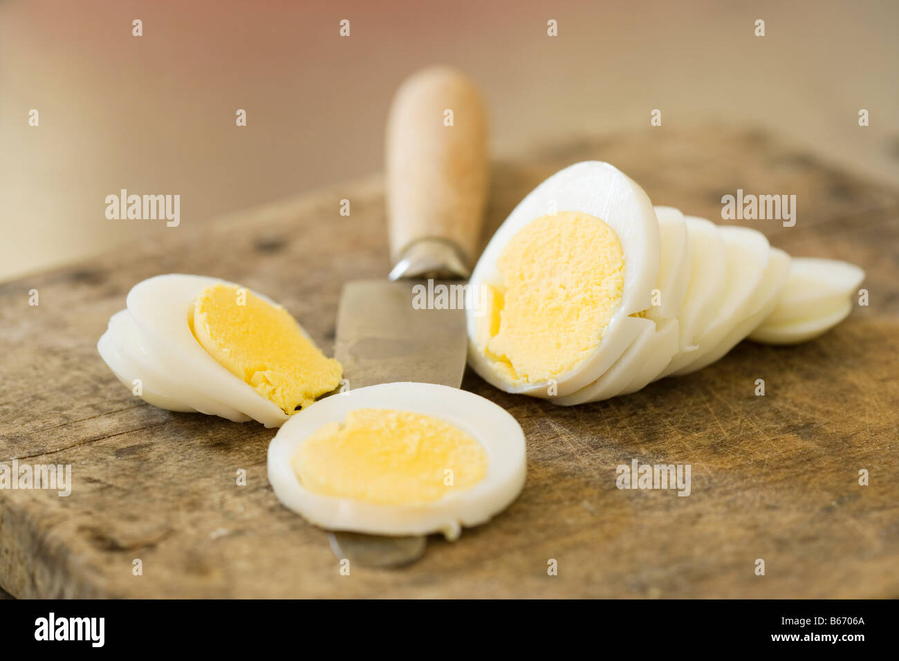 Sliced egg and a knife Stock Photo - Alamy