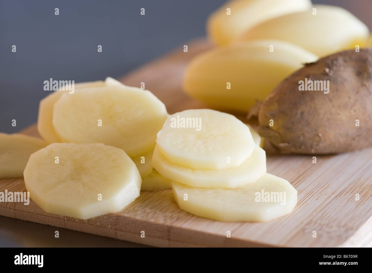 Slices of raw potato Stock Photo - Alamy