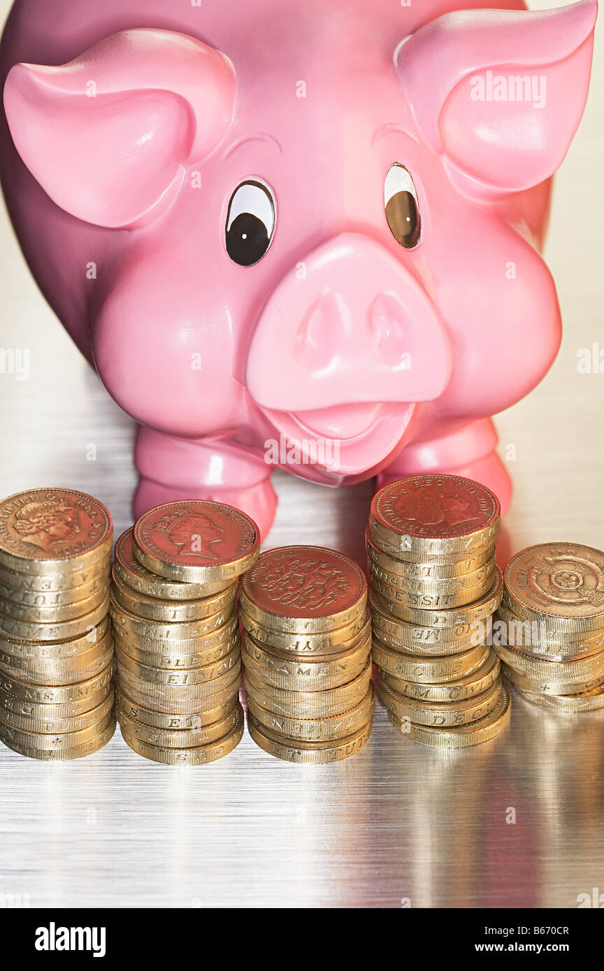 Piggy bank and stack of coins hi-res stock photography and images - Alamy