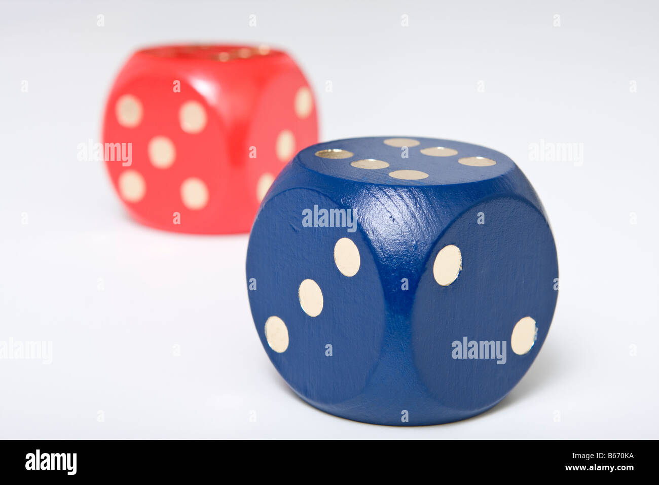 Red and blue dice on white background Stock Photo - Alamy
