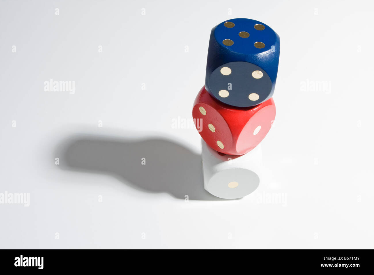 Stack of three dice on white background with shadow Stock Photo - Alamy
