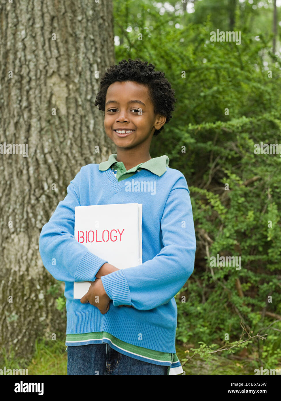 Boy with a book hi-res stock photography and images - Alamy