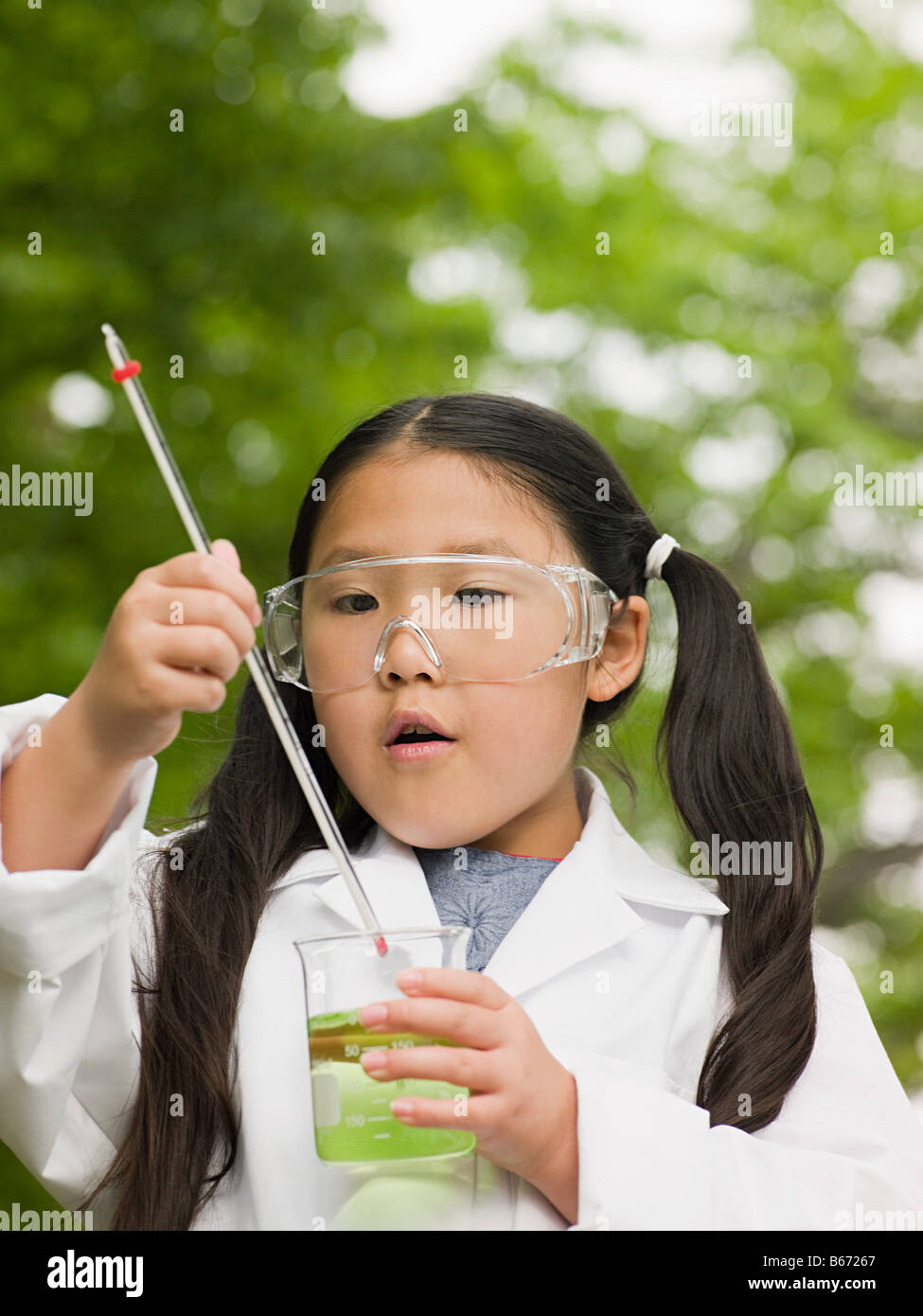 A girl doing an experiment Stock Photo - Alamy