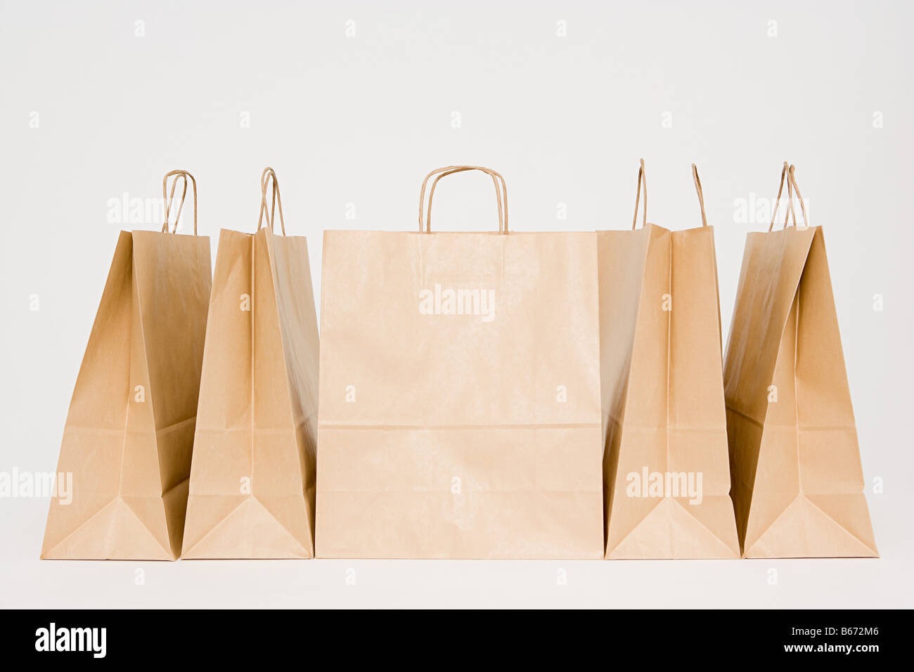 Paper bags in a row Stock Photo - Alamy