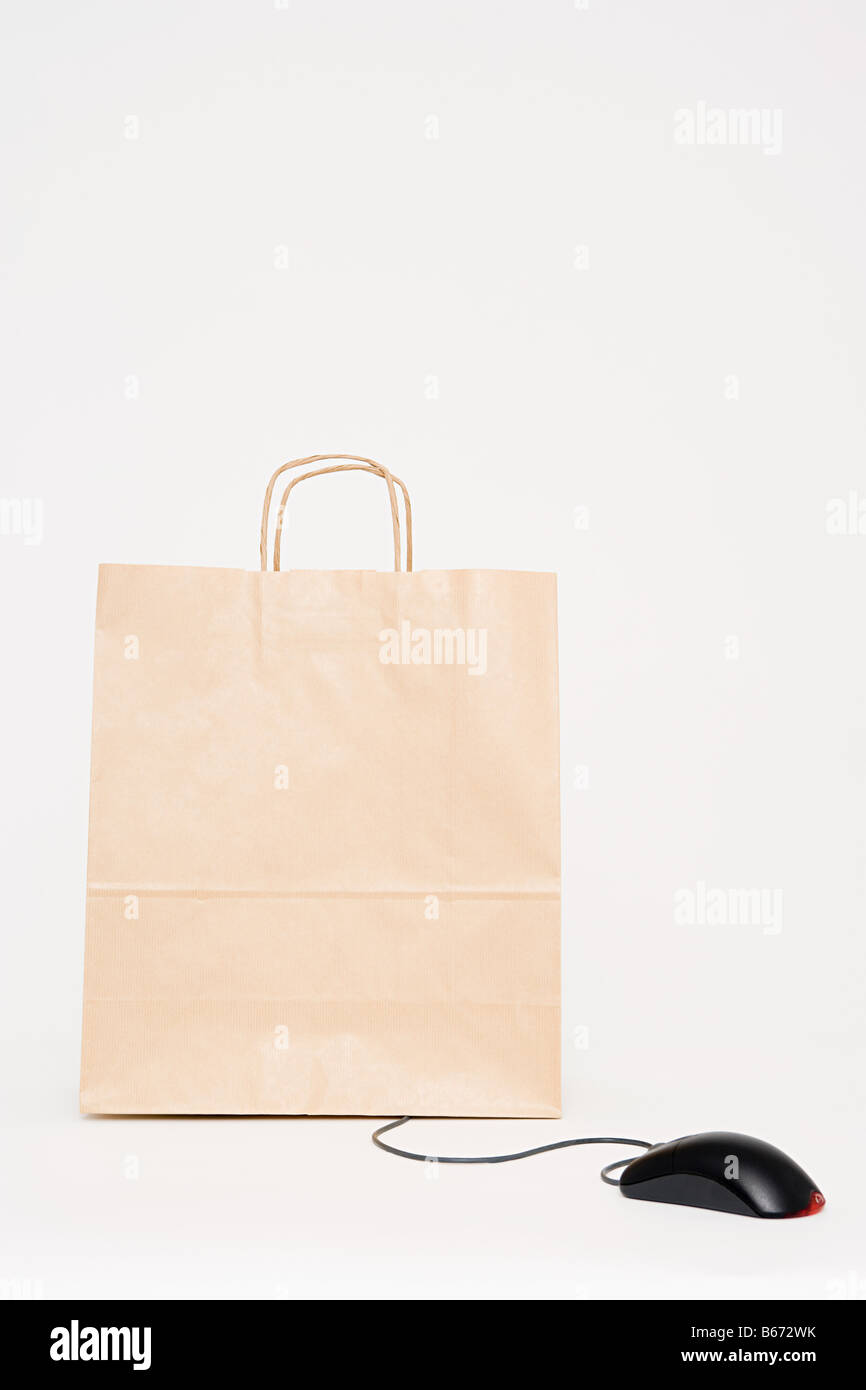 Computer mouse attached to a paper bag Stock Photo - Alamy