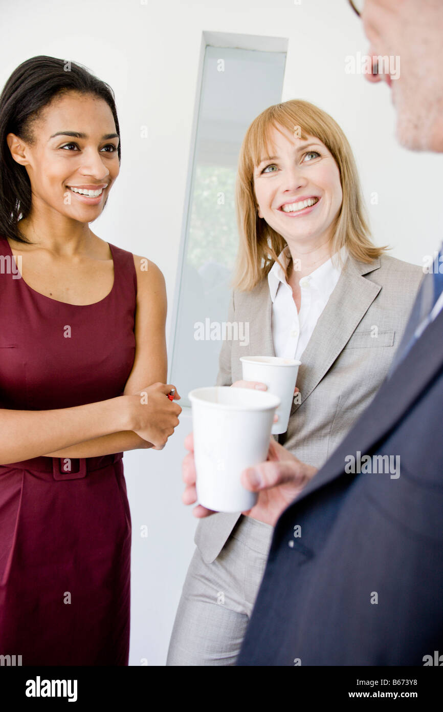 3 business people talking Stock Photo - Alamy