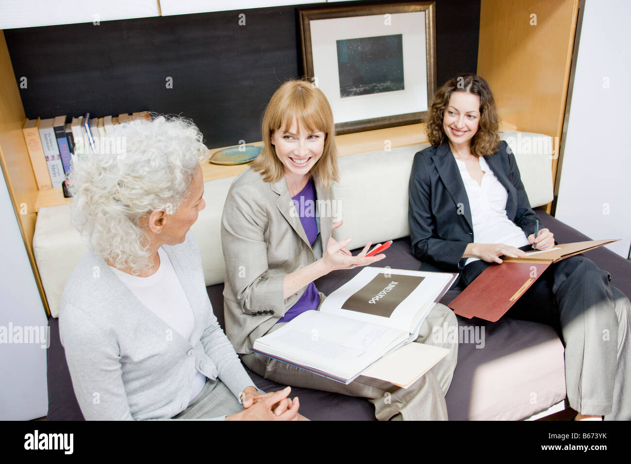 3 business people talking Stock Photo - Alamy
