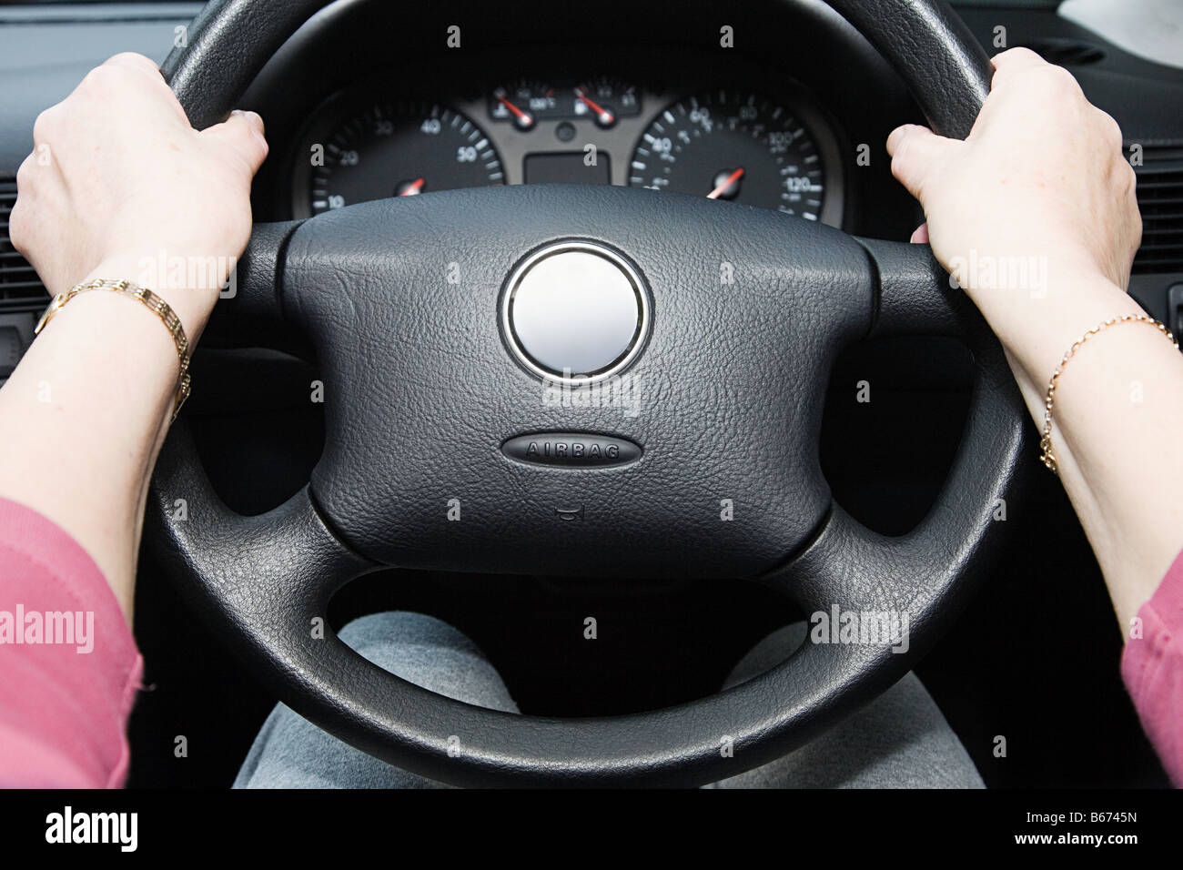 Watch wrist driving woman hi-res stock photography and images - Alamy
