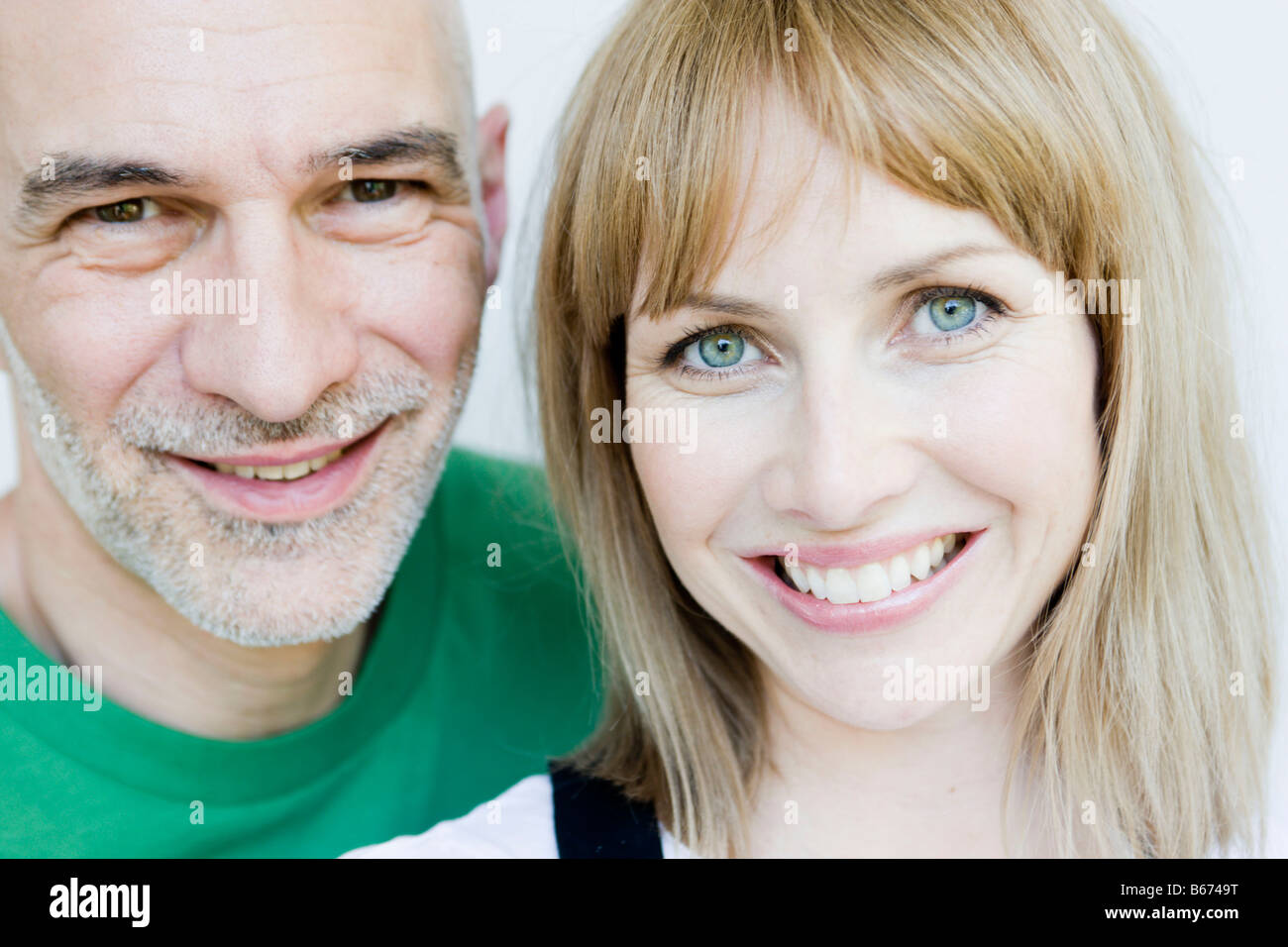 2 business people looking at viewer Stock Photo - Alamy