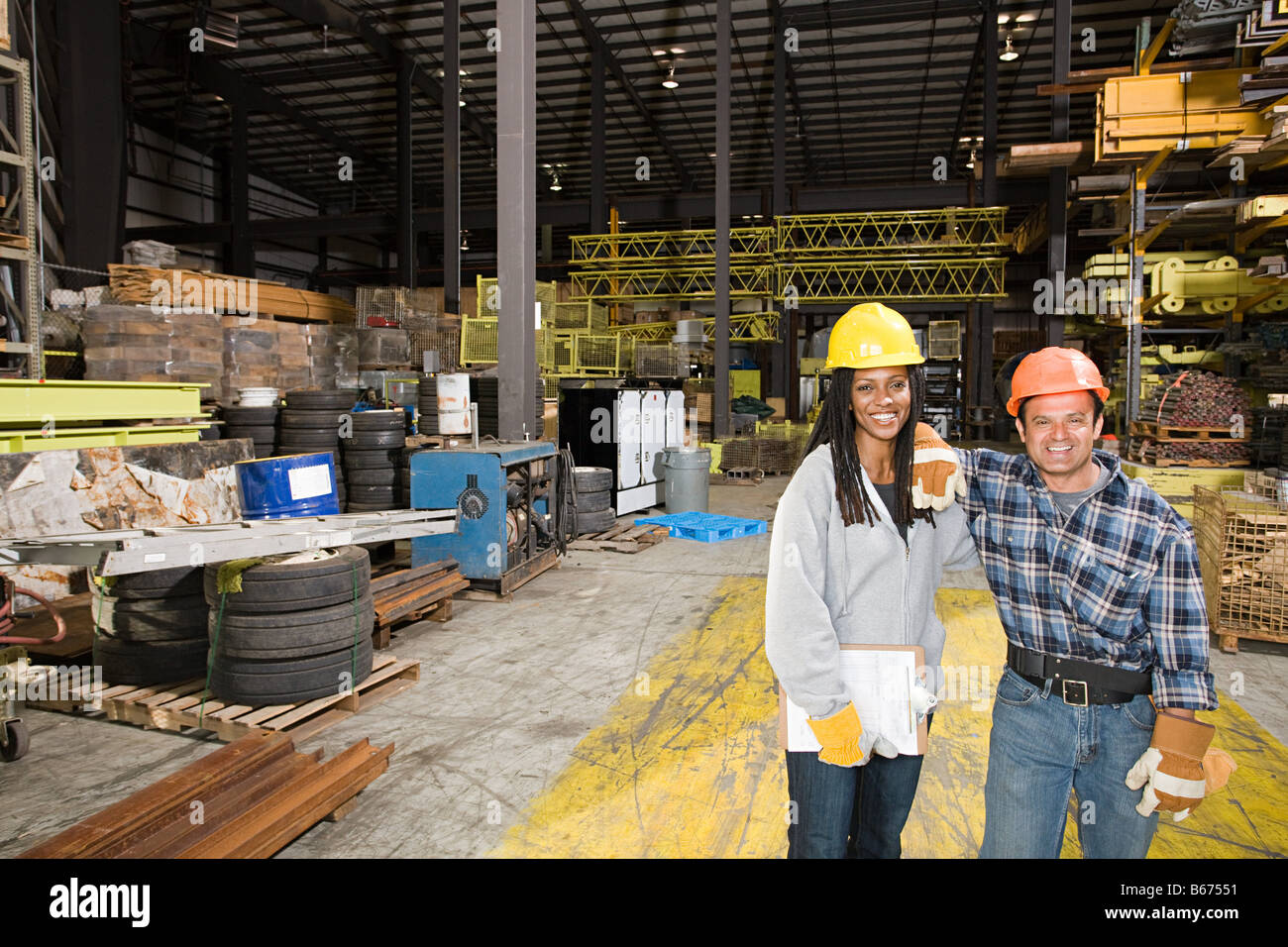 Colleagues in warehouse Stock Photo - Alamy