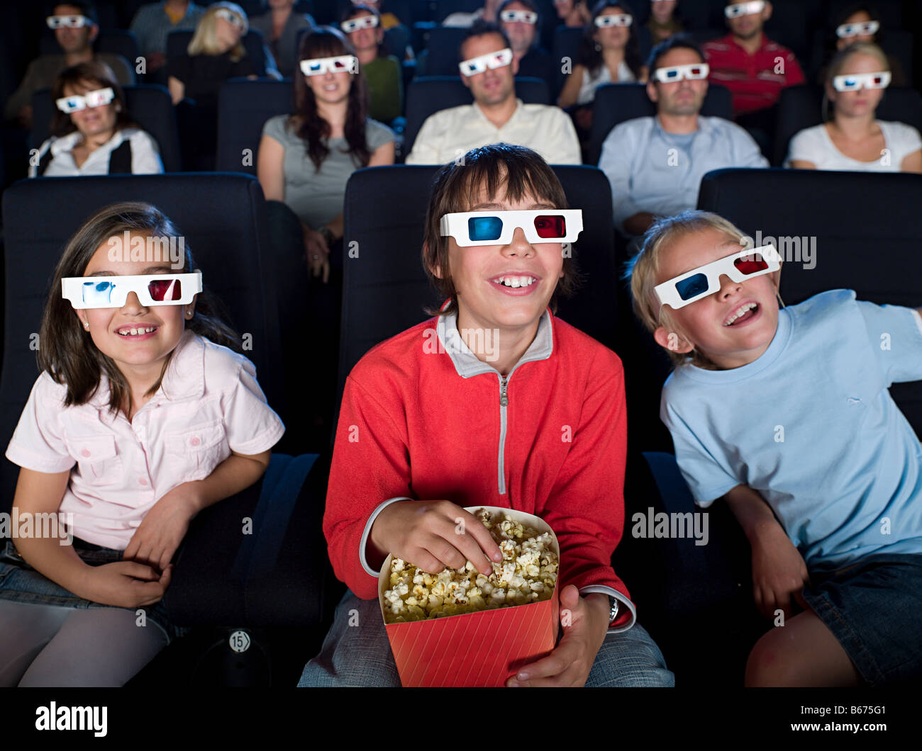 Children watching a 3d movie Stock Photo - Alamy