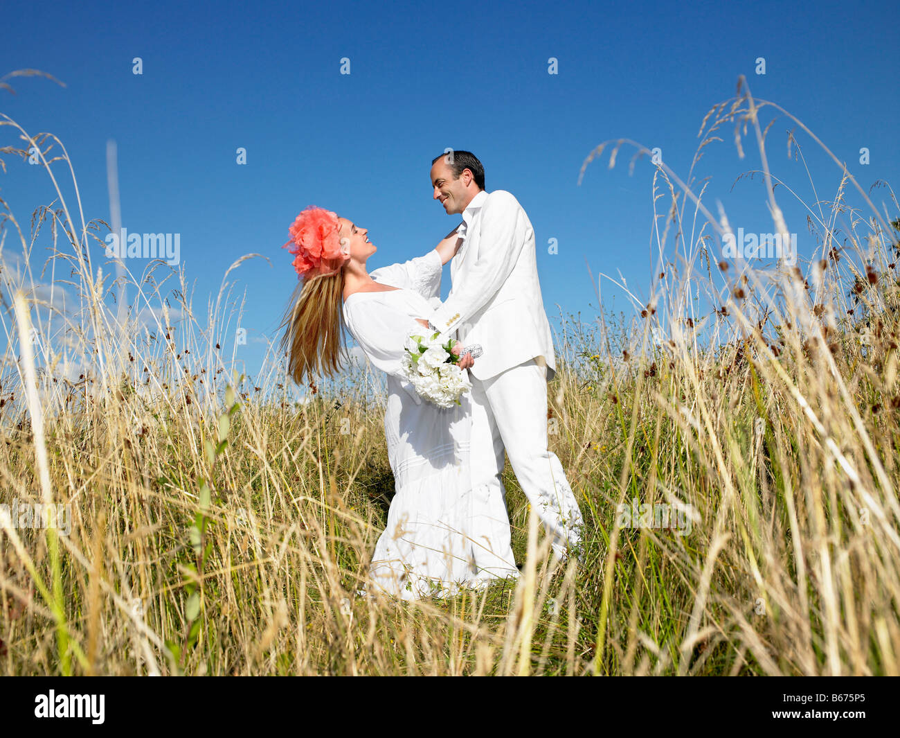 Married couple dancing in a field Stock Photo - Alamy