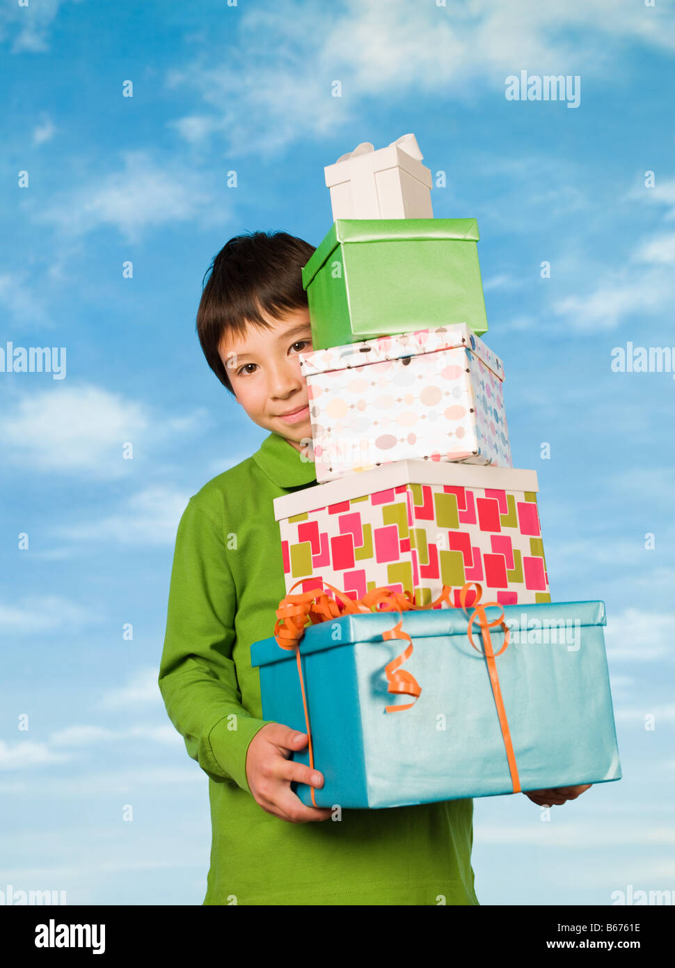 A boy carrying presents Stock Photo - Alamy