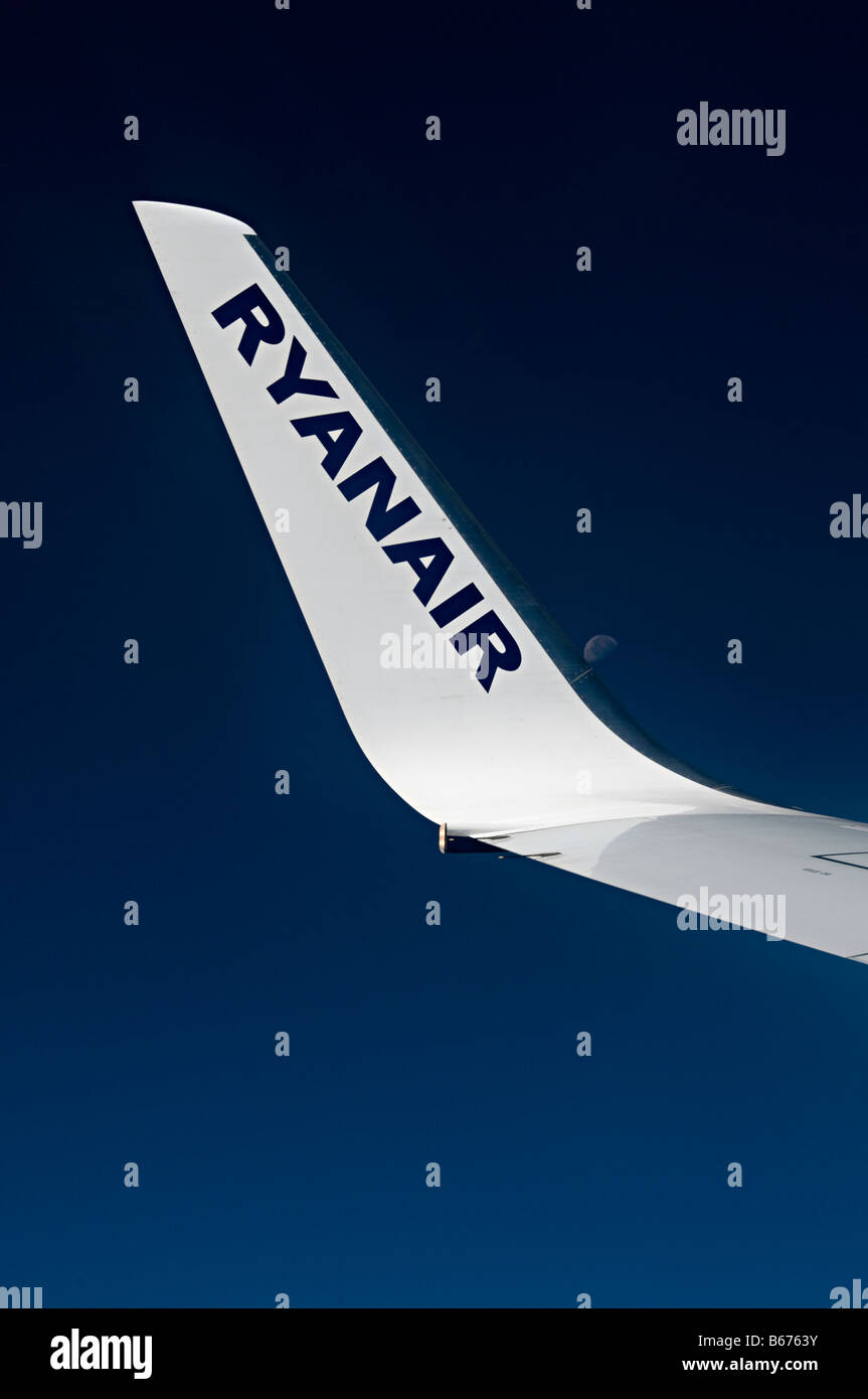 airplane wing tip in flight of a boeing 737 800 of a Ryanair plane ay ...