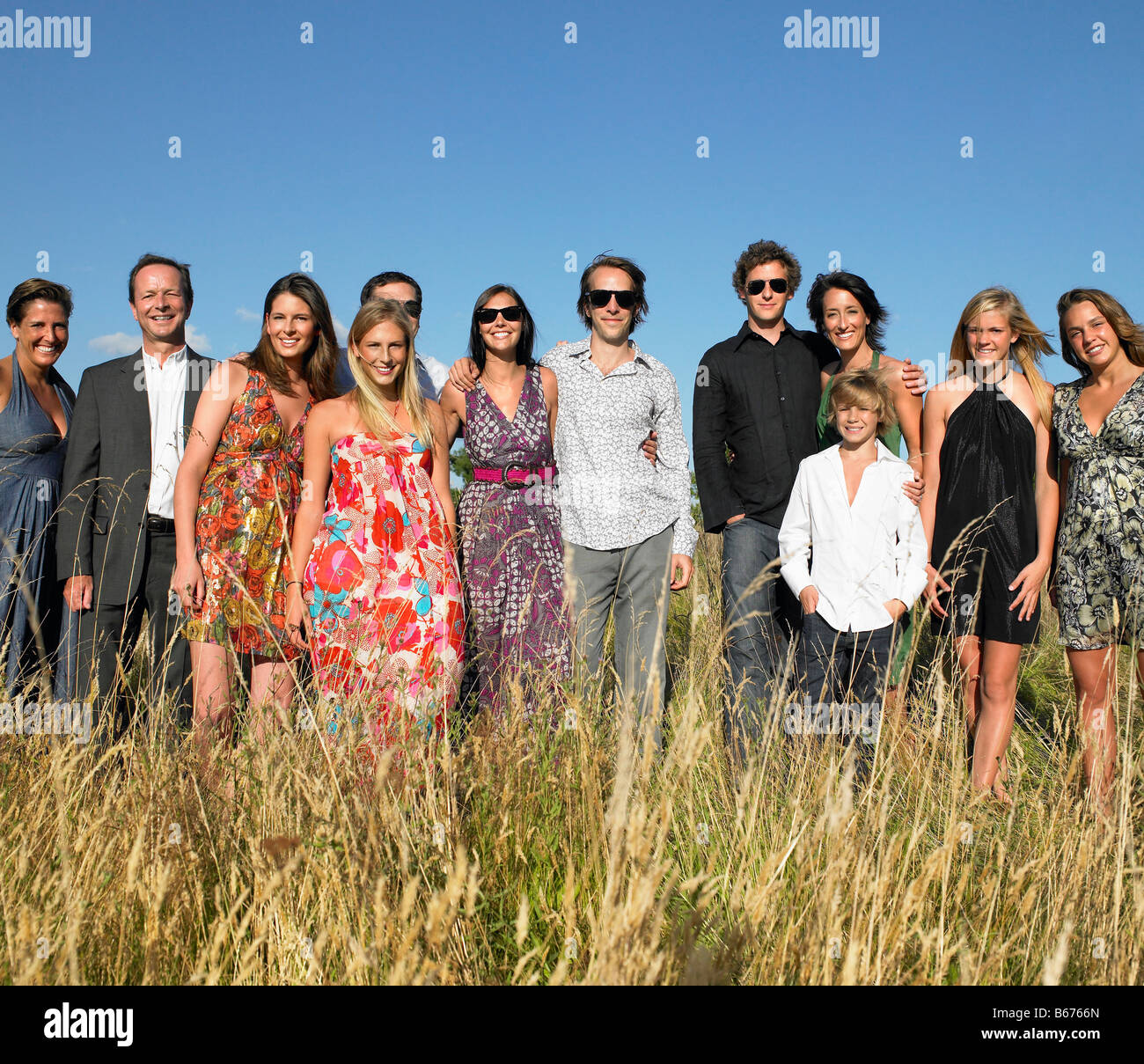 group of people in a field Stock Photo - Alamy