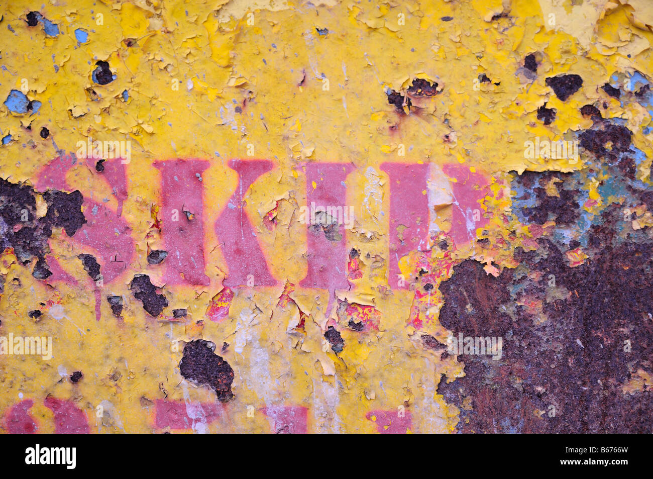 Side of an Old Yellow Skip Stock Photo - Alamy