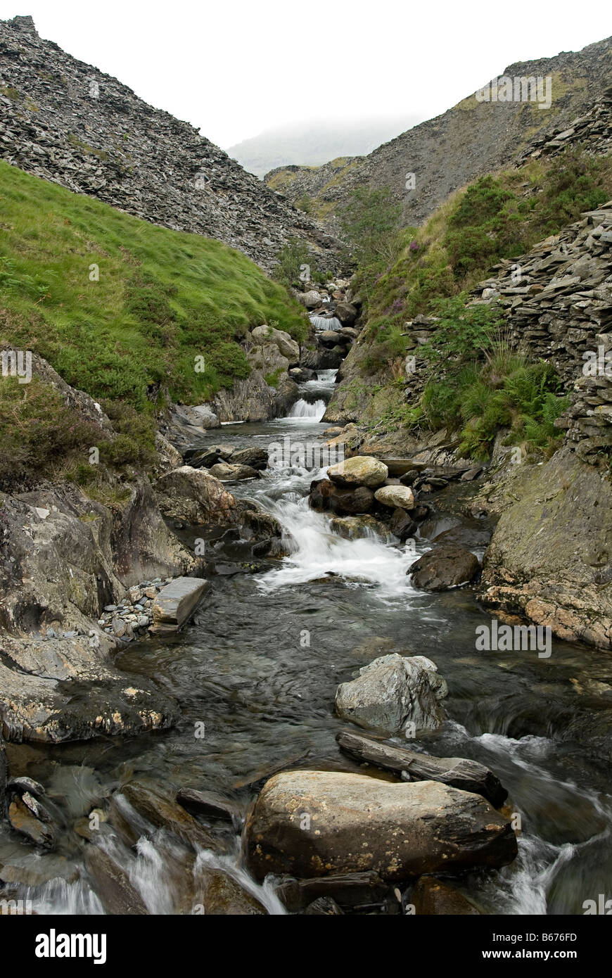 stream through slate mine on the mountainside from mining in snowdon ...