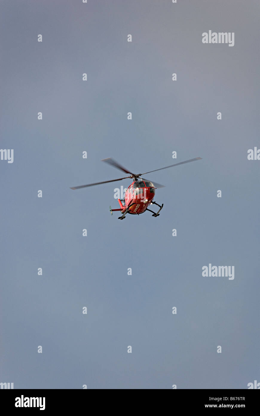 welsh air ambulance flying on the west coast of wales on a sunny day ...