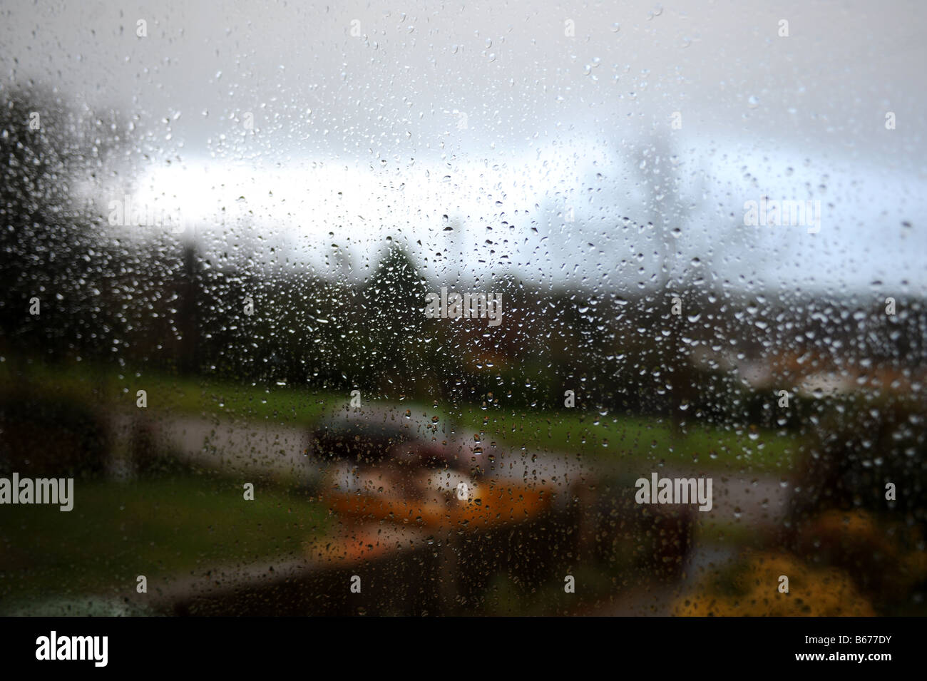 Rain on glass window in England on a gloomy winters day Stock Photo - Alamy