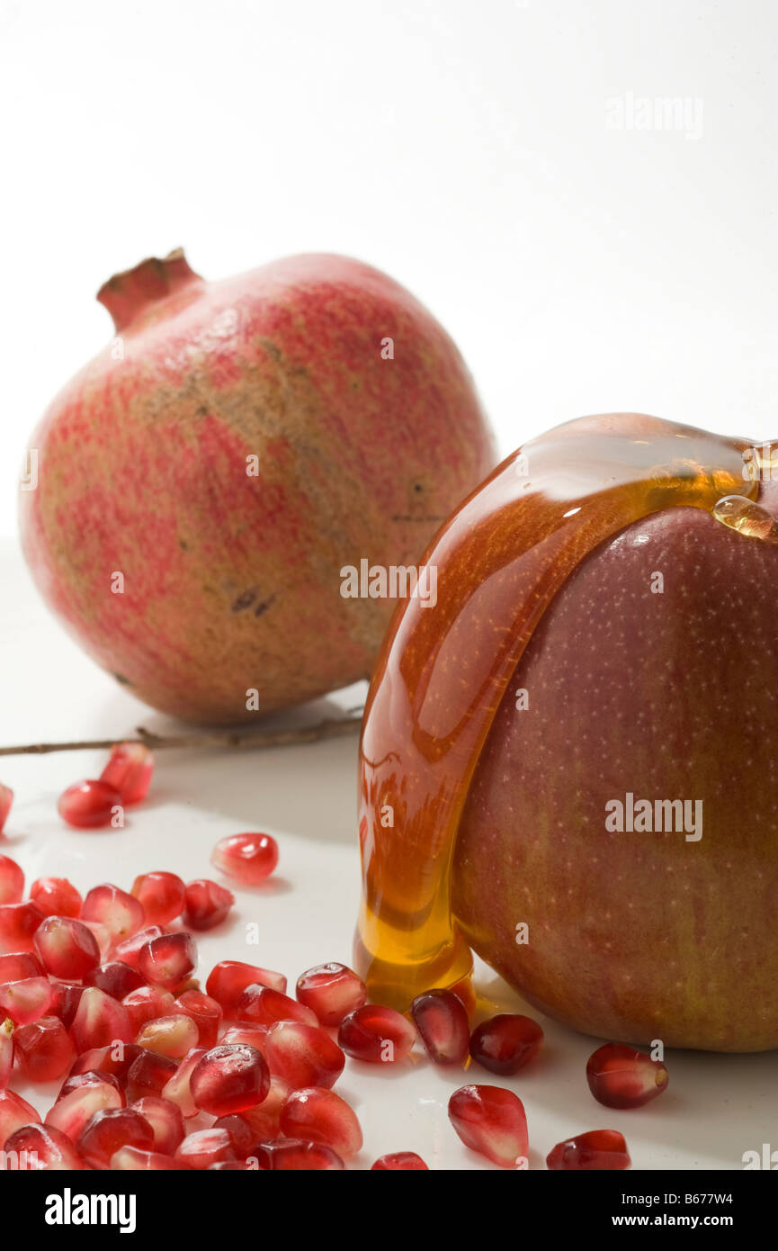 Apple pomegranate seeds and honey Symbols of Roah Hashanah the Jewish ...