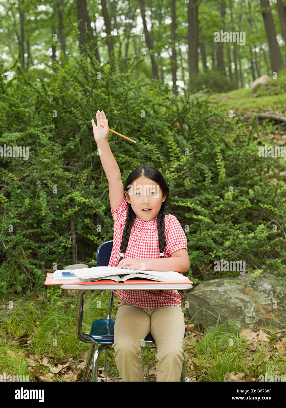 A girl with her arm raised Stock Photo - Alamy