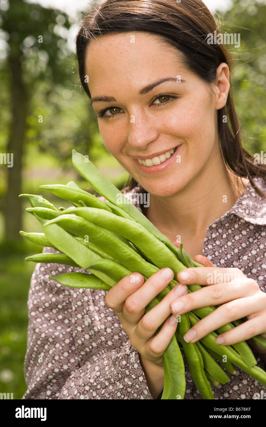 Woman growing beans hi-res stock photography and images - Alamy