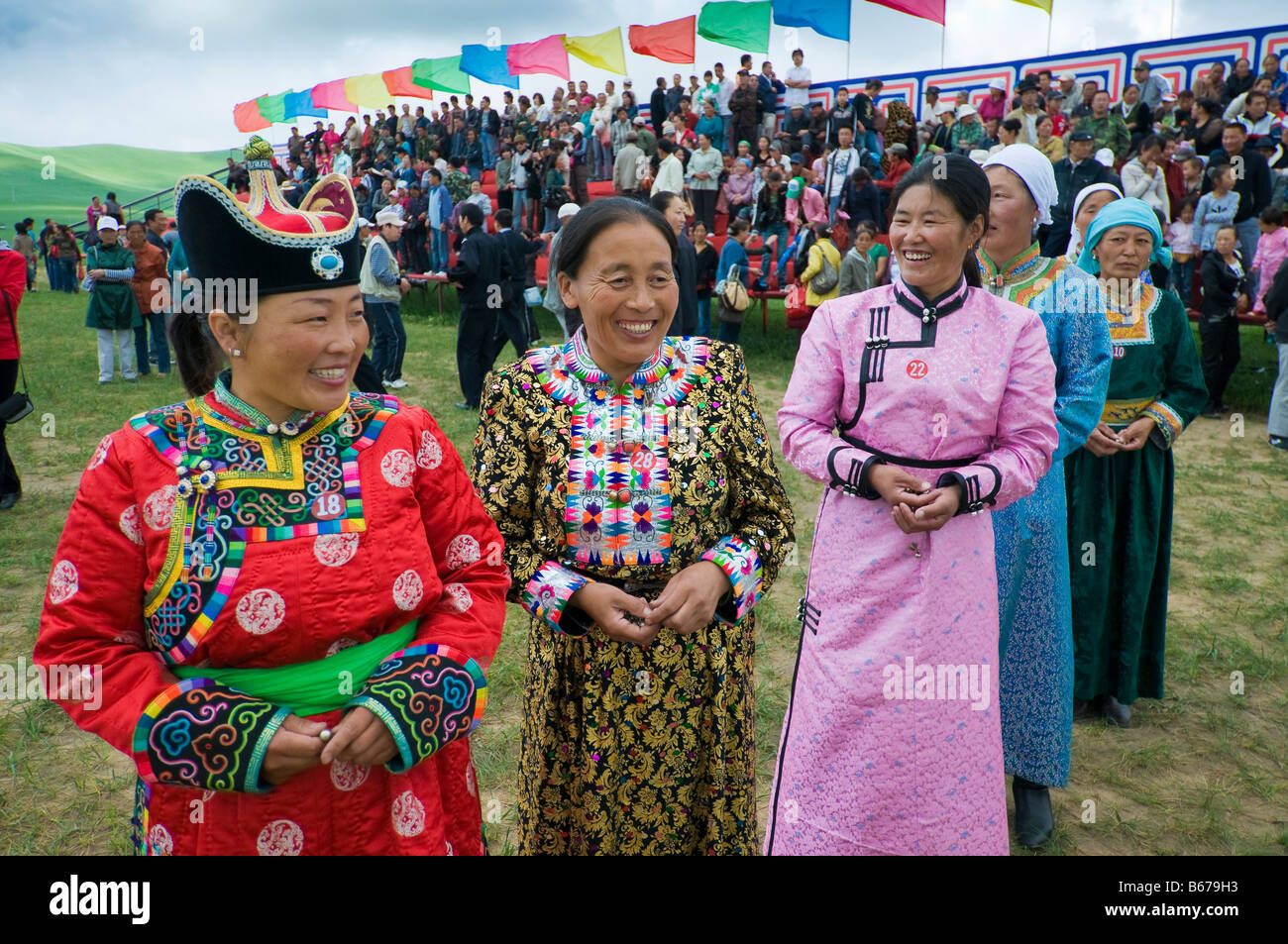 Readying for competition traditionally dressed ethnic Mongolians attend ...