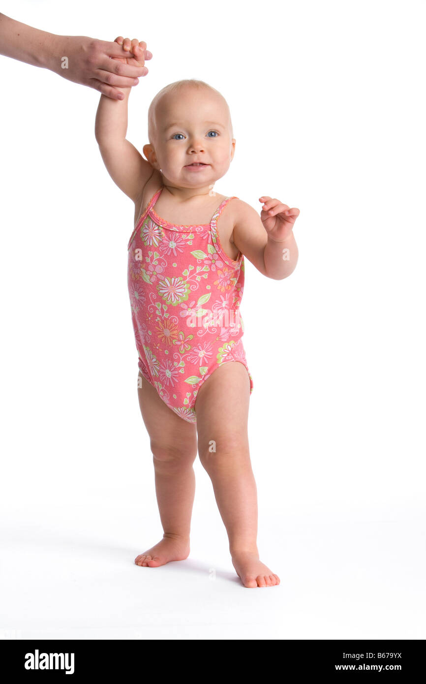 Baby girl setting first steps hi-res stock photography and images - Alamy