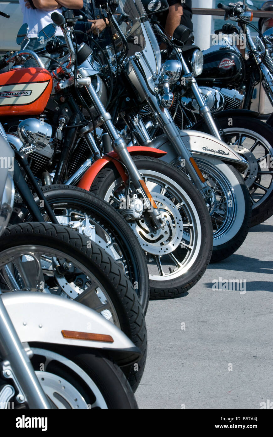 Front wheels of Harley Davidson motorcycles parked Stock Photo - Alamy