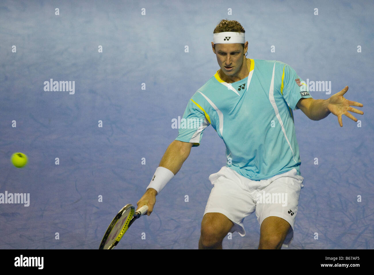 Argentinian tennis player David Nalbandian hitting a backhand shot ...