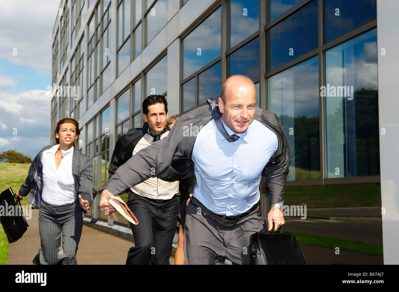 Business people running Stock Photo - Alamy