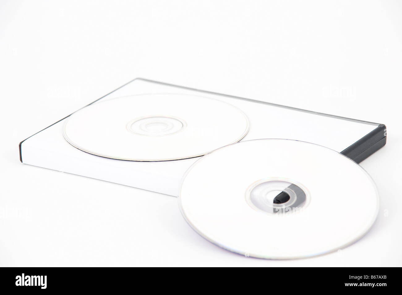 Two Blank DVDs on a case at an angle Stock Photo - Alamy
