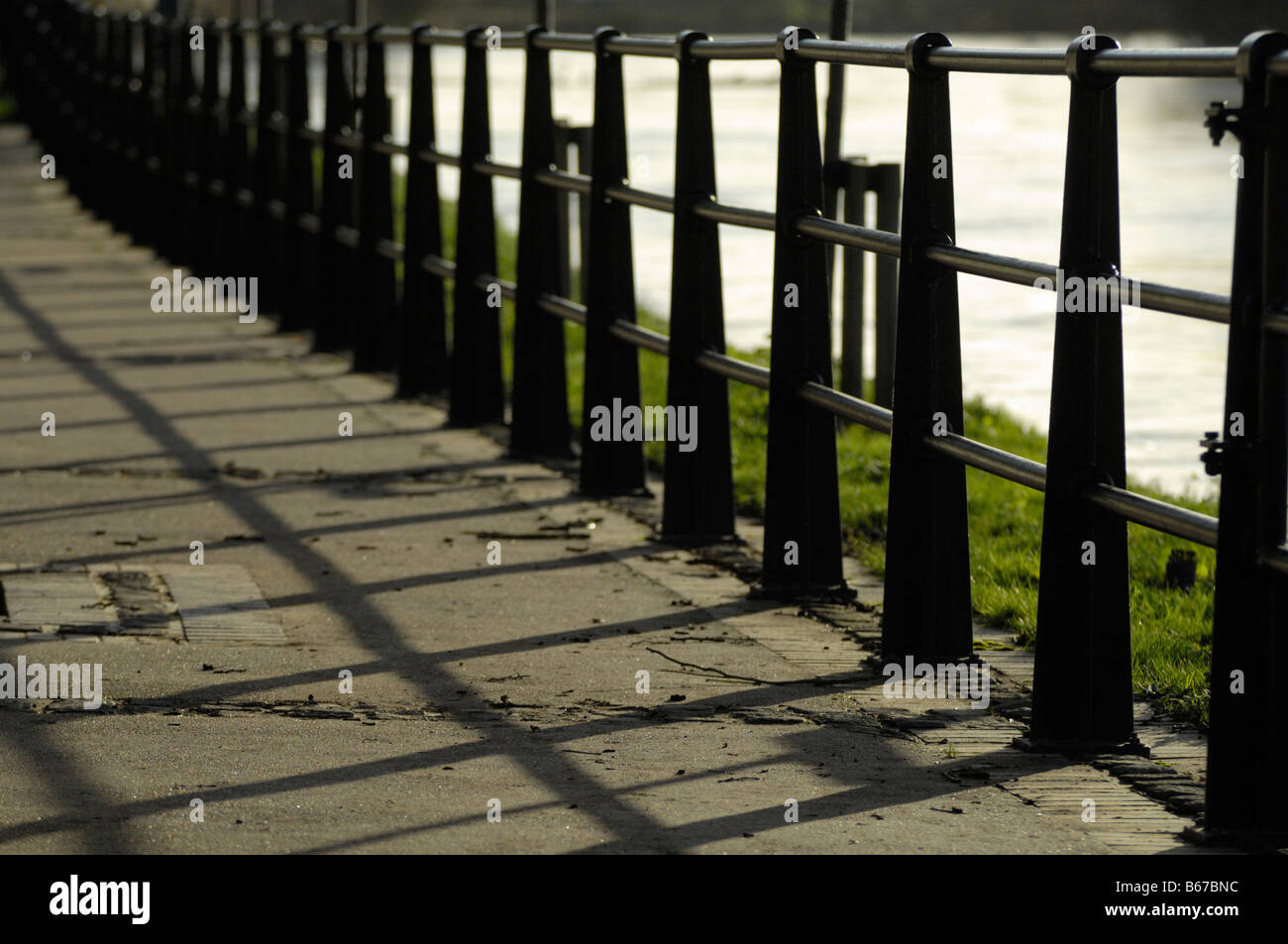 Abstract pattern of riverside railings and shadows in sunshine Stock ...