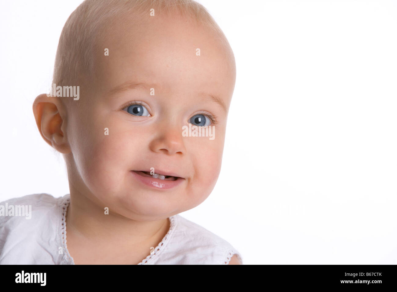 Portrait of a baby girl with two new teeth Stock Photo - Alamy
