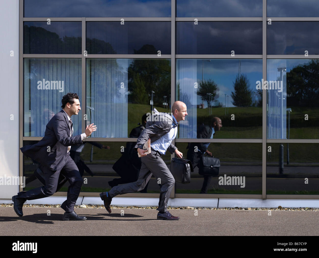Business people running Stock Photo - Alamy