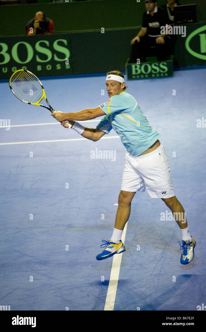 Argentinian tennis player David Nalbandian hitting a backhand shot ...