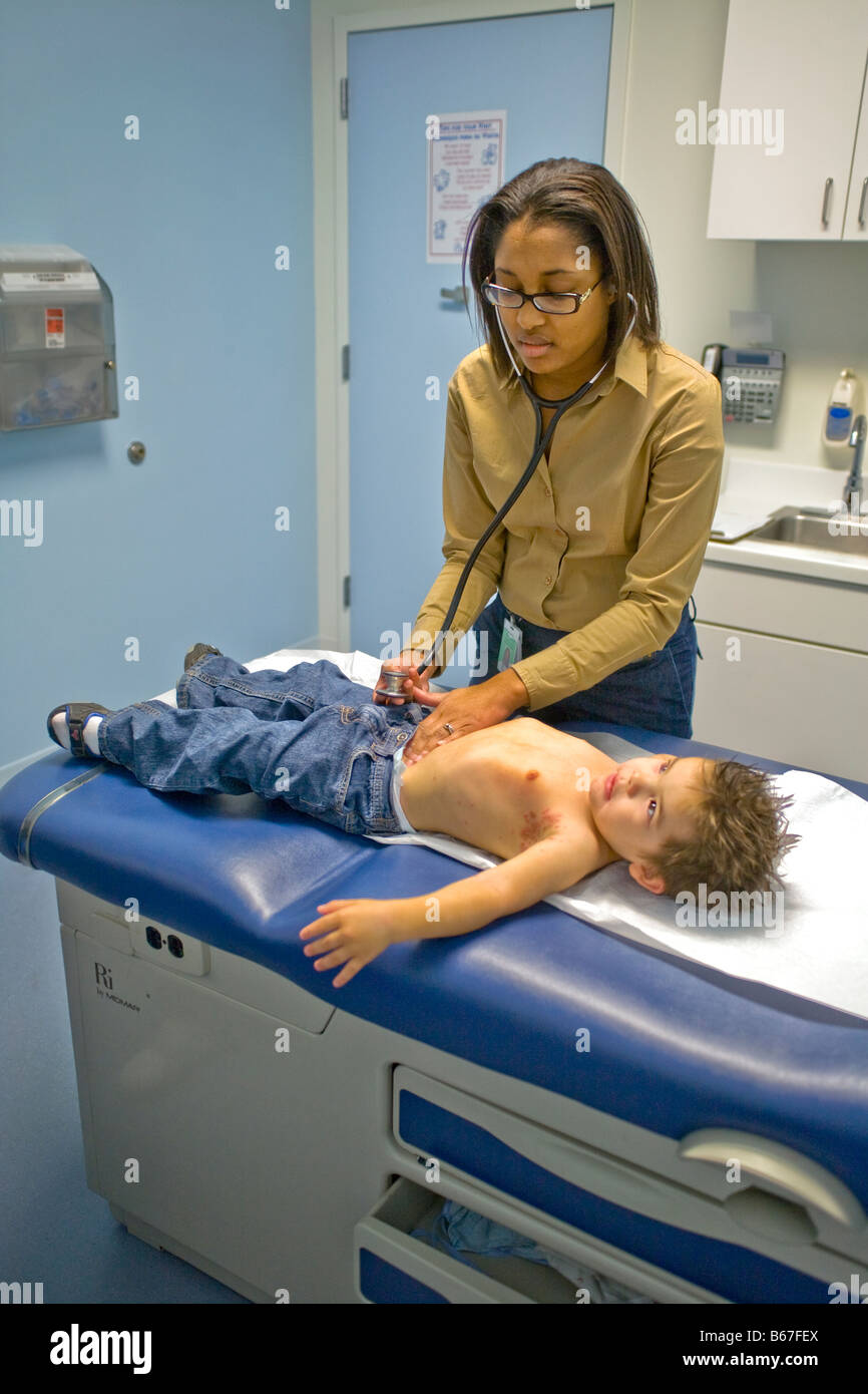 Female doctor examining boy at Childrens Hospital of Orange County in ...