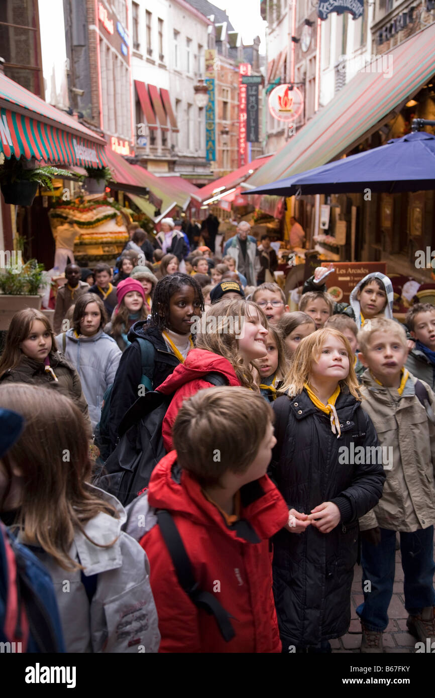 Group of school children in narrow streets near the Grand Place in ...
