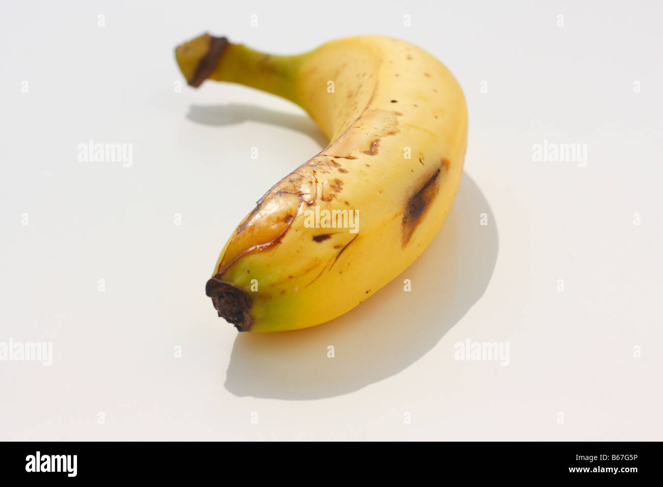 Whole ripe banana on a white background Stock Photo - Alamy
