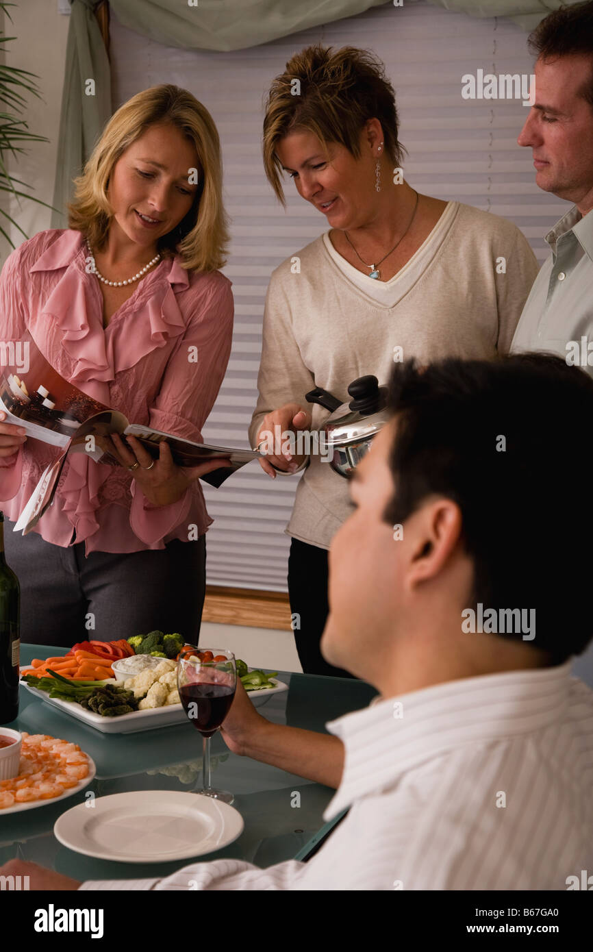 Group of people talking at table Stock Photo - Alamy