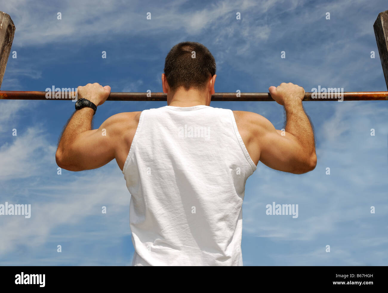 Reaching Goal Strong Man Doing Pull ups on a Bar in a Park Stock Photo ...