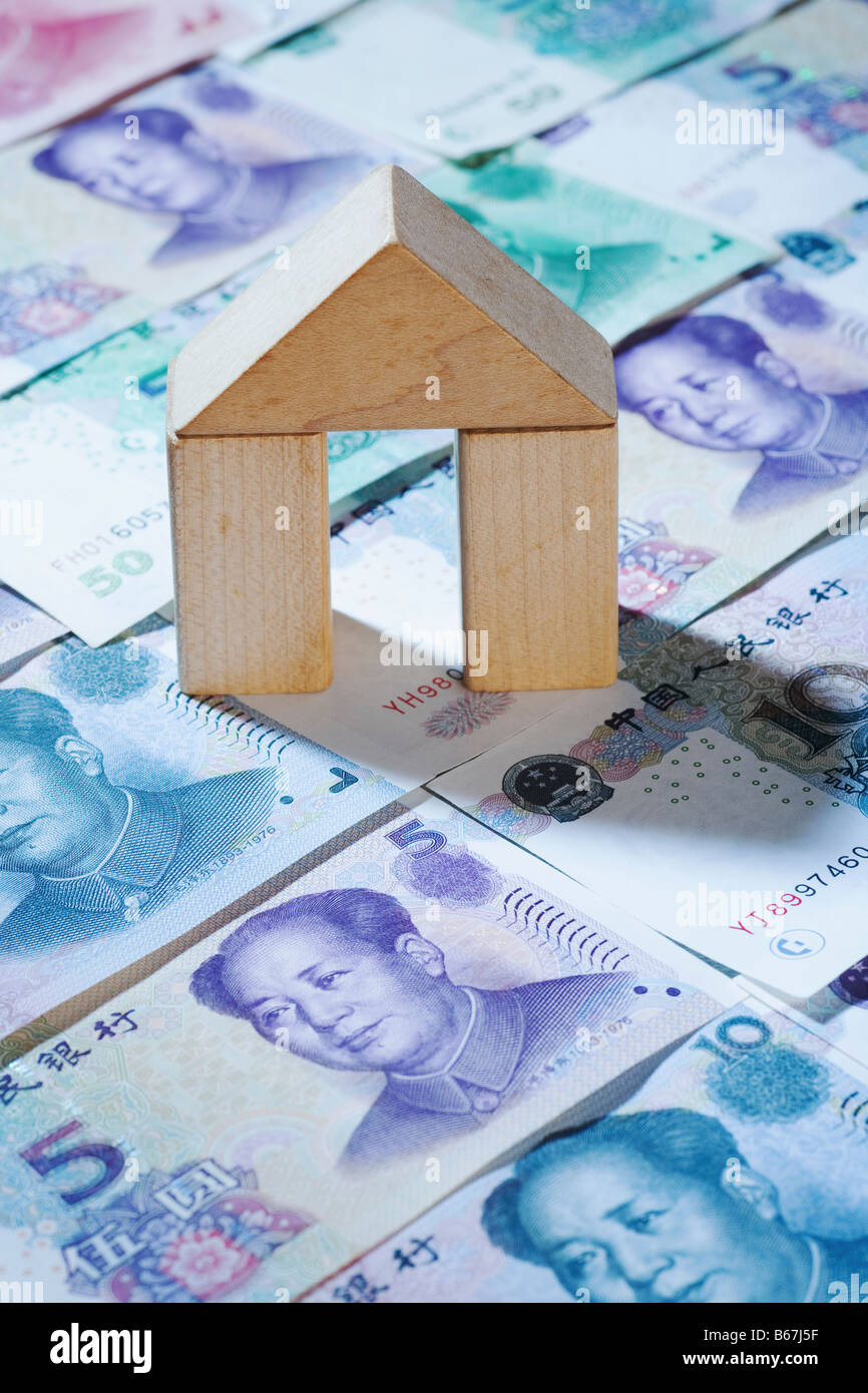 Model house on paper currency Stock Photo - Alamy