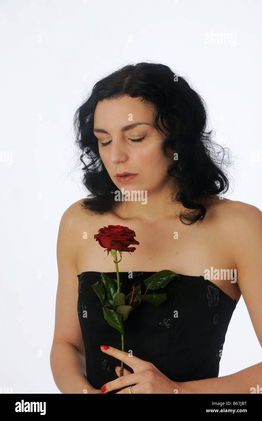 Woman holding a single Red Rose Stock Photo - Alamy